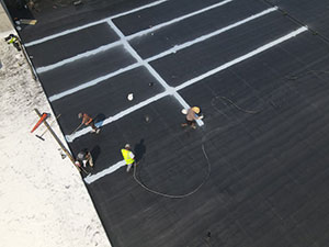 The Benefits of a Rubber Roof Coating | First Class Roofing